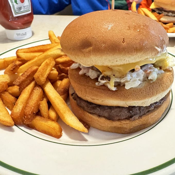 This isn't just a cheeseburger&mdash;it's edible architecture. The melty cheese and crispy fries are what comfort food dreams are made of.