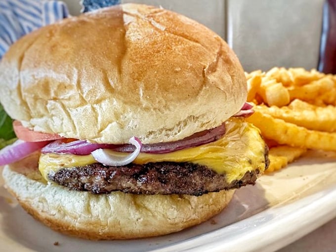 Behold the star of the show: a perfectly charred patty, melty cheese, and fresh toppings on a pillowy bun. Napkins required, regrets impossible.