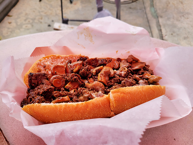 Behold the star of our show&mdash;thinly sliced beef, caramelized onions, and melted cheese creating the holy trinity of sandwich perfection.