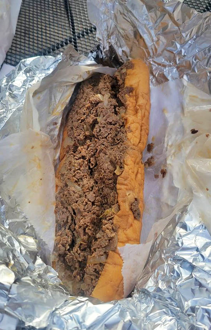 Behold the star of the show! This cheesesteak isn't just a sandwich; it's a masterclass in the art of beef-to-bread ratio.