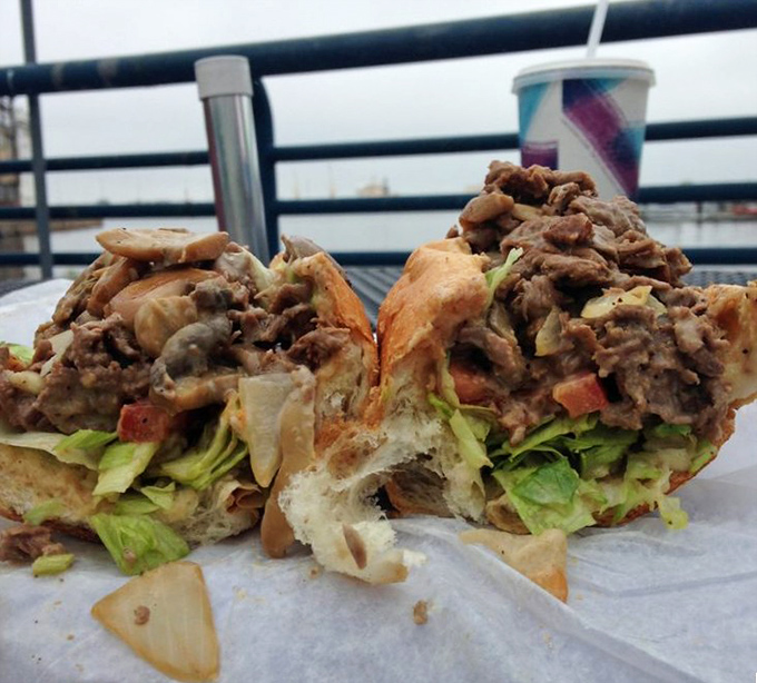 A masterpiece of meat and bread enjoying the waterfront view. This cheesesteak hoagie, packed with thinly sliced beef and fresh veggies, is Philadelphia's edible love letter.