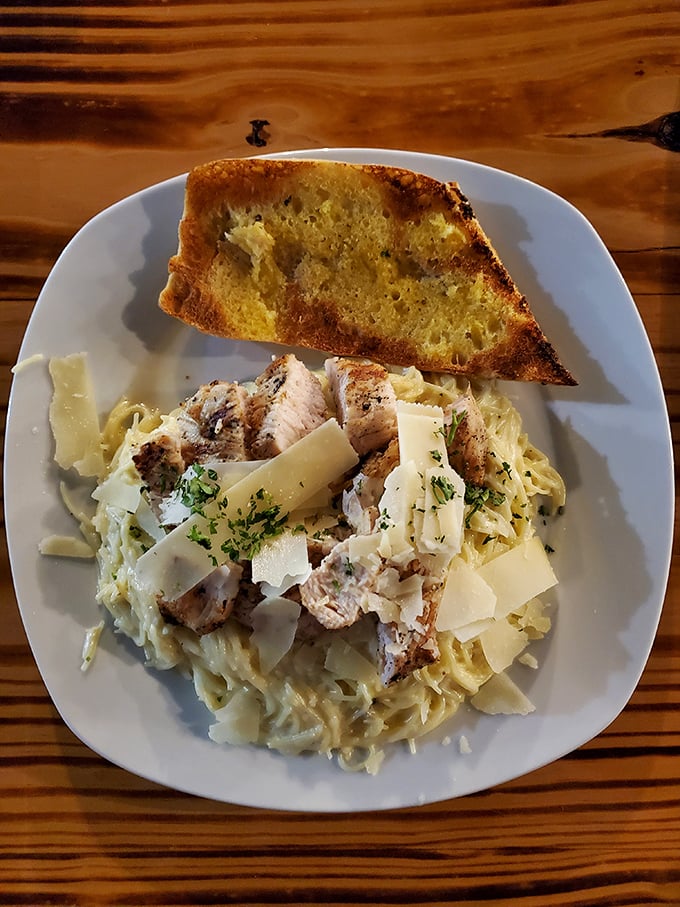 The infamous Chicken Alfredo that's causing traffic jams in Newberry. Creamy, dreamy pasta topped with perfectly seasoned chicken and a slice of garlic bread for good measure.