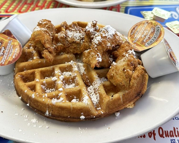 Behold the crown jewel&mdash;chicken and waffles dusted with powdered sugar. Sweet meets savory in a dish that makes you question why we ever separated breakfast from dinner.
