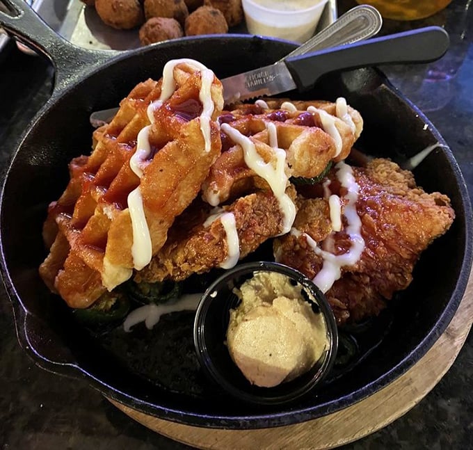 Chicken and waffles served in a cast iron skillet&mdash;because regular plates simply can't contain this much joy. Sweet meets savory in perfect harmony.