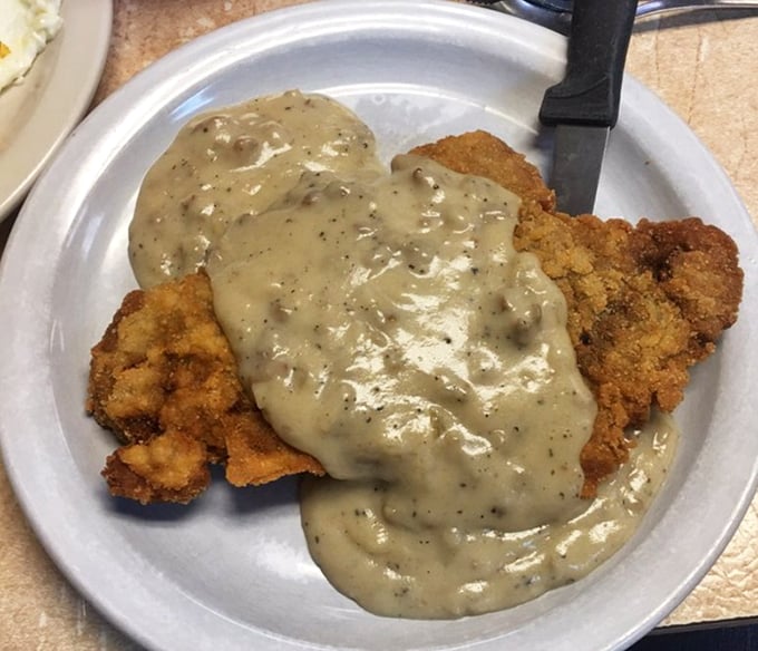 Chicken fried steak drowning in sausage gravy: proof that some problems are delicious and worth creating for yourself.
