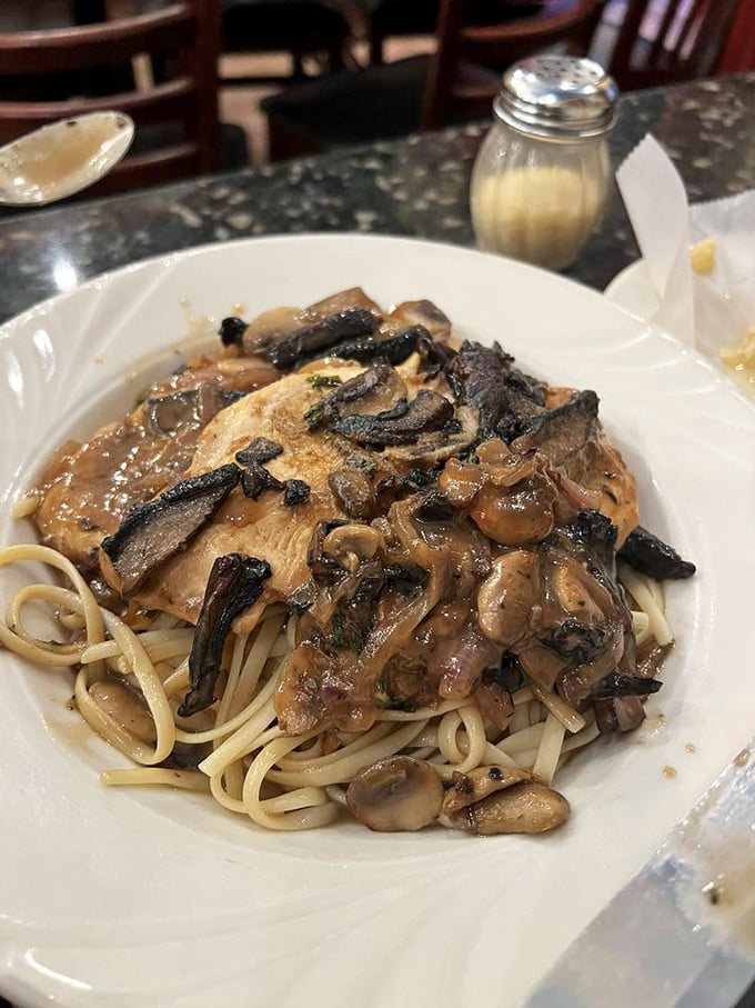 The legendary Chicken Marsala arrives like a work of art&mdash;tender chicken beneath a mushroom constellation, swimming in a wine sauce that should be bottled and sold as perfume.