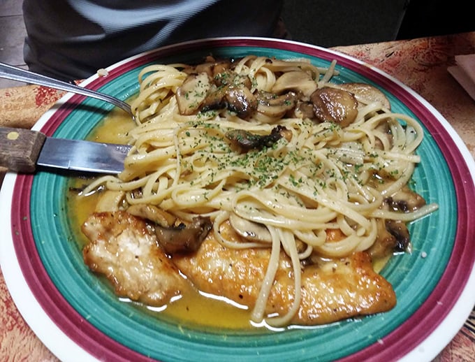 The legendary chicken Marsala in all its glory—golden chicken nestled in a silky wine sauce with mushrooms. This plate has launched a thousand food dreams.