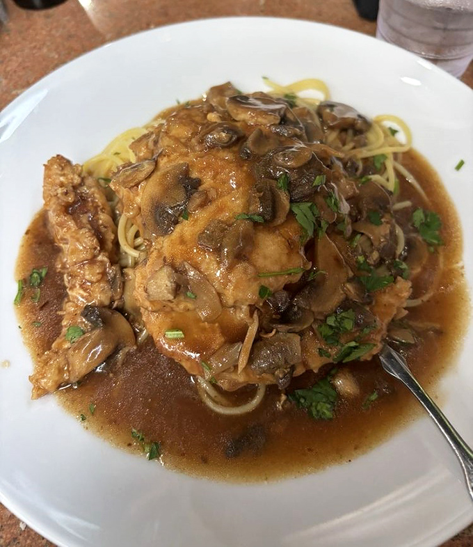 The legendary Chicken Marsala&mdash;tender cutlets swimming in a mushroom-wine sauce so good you'll want to bottle it and take it home.