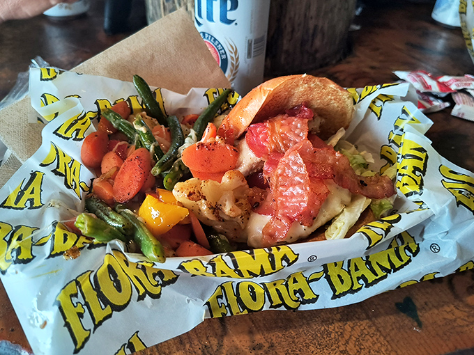 Not just any seafood basket&mdash;this Flora-Bama creation bursts with fresh vegetables and Gulf seafood, served on their signature yellow paper that's become Instagram-famous.