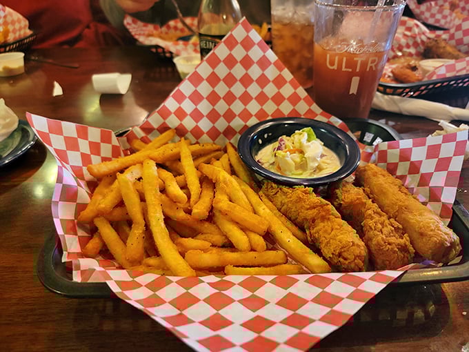 Golden fries and perfectly breaded chicken tenders arrive in a classic red-checkered basket&mdash;comfort food that doesn't need to show off to impress.