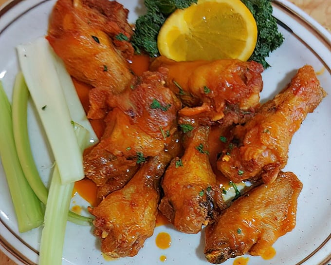 Buffalo wings that don't mess around &ndash; crispy, saucy, and served with the obligatory celery peace offering.