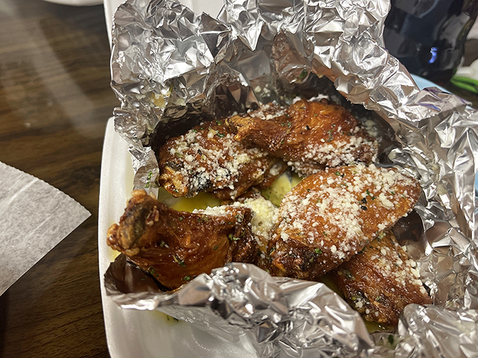These aren't just wings; they're a religious experience dusted with parmesan &ndash; crispy, saucy perfection that justifies the pilgrimage to Pittsburgh.
