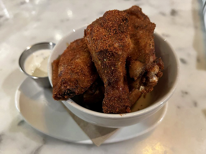 These aren't just wings; they're crispy little flavor bombs that make you question why you ever bothered with those chain restaurant versions. The dipping sauce is practically drinkable.