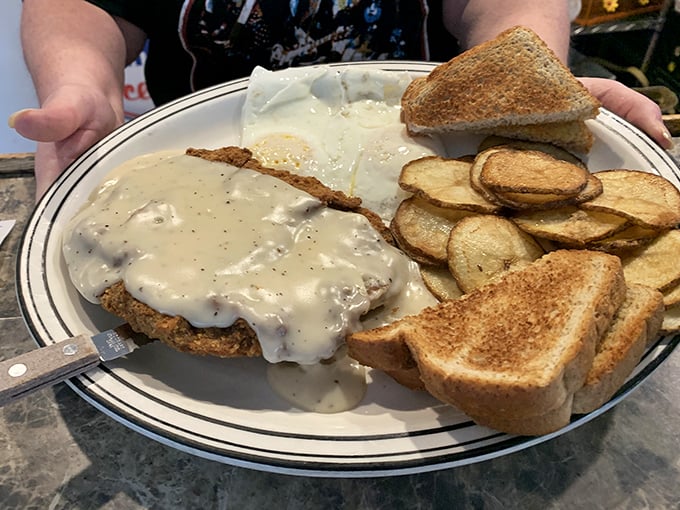 Country-fried steak smothered in gravy that could make your cardiologist wince but your soul sing. Worth every delicious calorie.