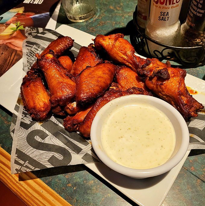 These aren't just wings; they're a masterclass in smoke and sauce, glistening with promise and practically begging to be devoured.