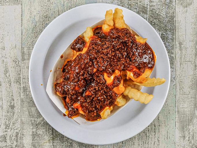 Behold the crown jewel: chili cheese fries that maintain their structural integrity while delivering maximum flavor in every bite.