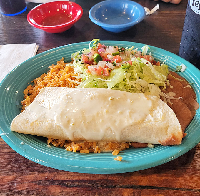 This isn't just a chimichanga&mdash;it's a masterpiece of crispy-meets-creamy wrapped in a tortilla hug. The cheese blanket on top seals the deal. 
