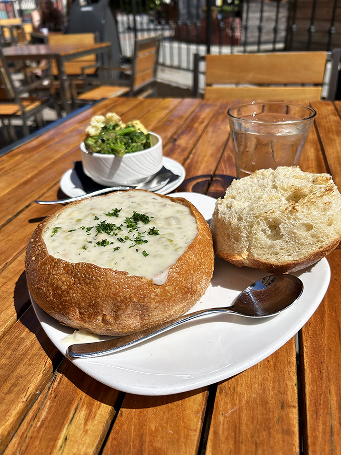 Not just any bread bowl&mdash;this is San Francisco sourdough cradling creamy clam chowder like it was destiny, with fresh herbs adding that perfect finishing touch.