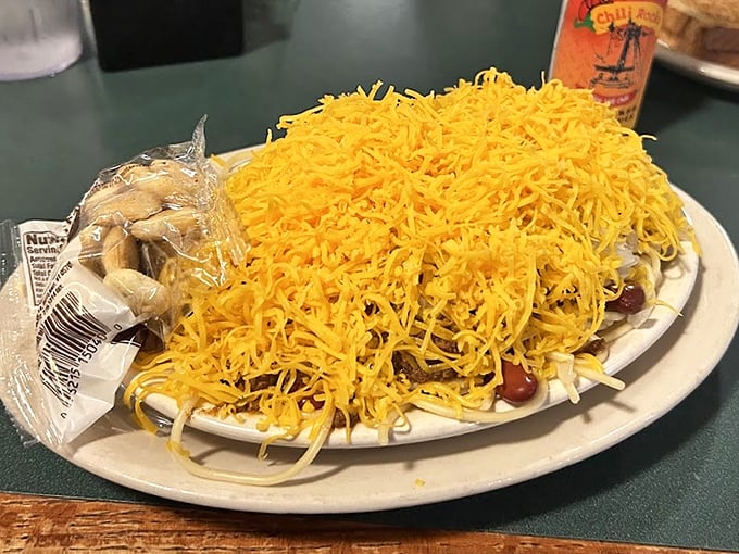 Behold the famous Cincinnati five-way chili in all its glory! That mountain of finely shredded cheddar isn't just a topping&mdash;it's practically its own food group.