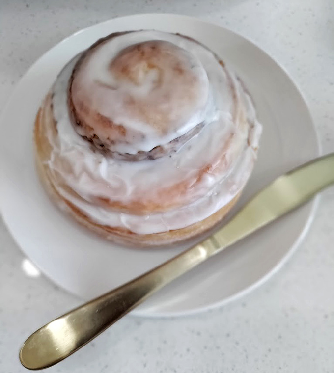 This cinnamon roll isn't just breakfast&mdash;it's an event. The glaze pools in all the right places, promising sweet surrender with every bite.