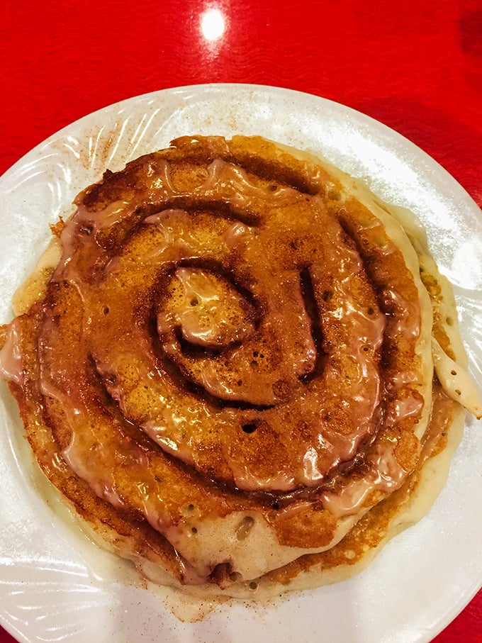 The cinnamon roll pancake: proof that breakfast and dessert can coexist peacefully. That spiral of cinnamon and glaze is basically edible hypnosis.