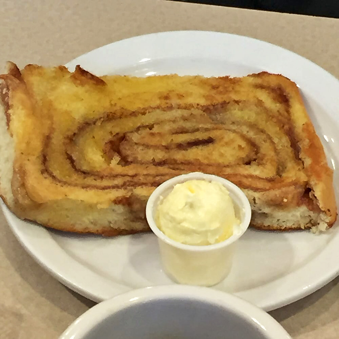 Not just a cinnamon roll, but a spiritual experience with a side of butter. This is what clouds must taste like if they were made of cinnamon.