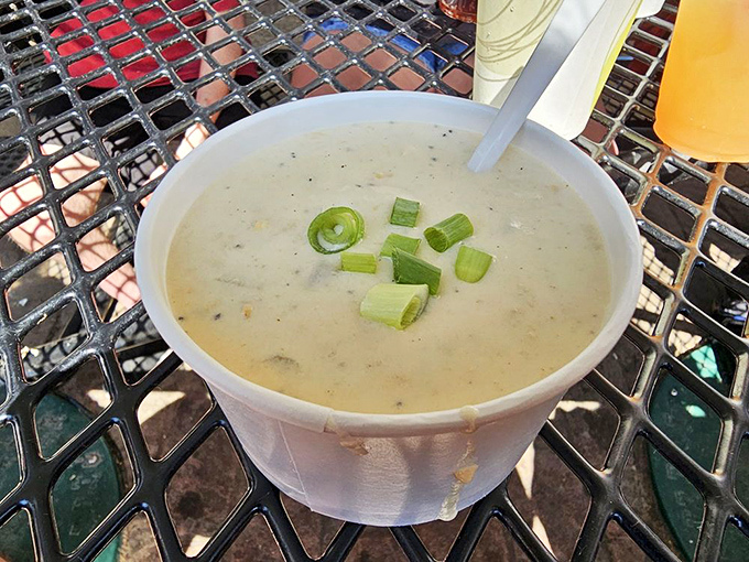 The legendary clam chowder arrives with a sprinkle of green onions, like a creamy ocean in a cup. This isn't soup&mdash;it's a maritime miracle.