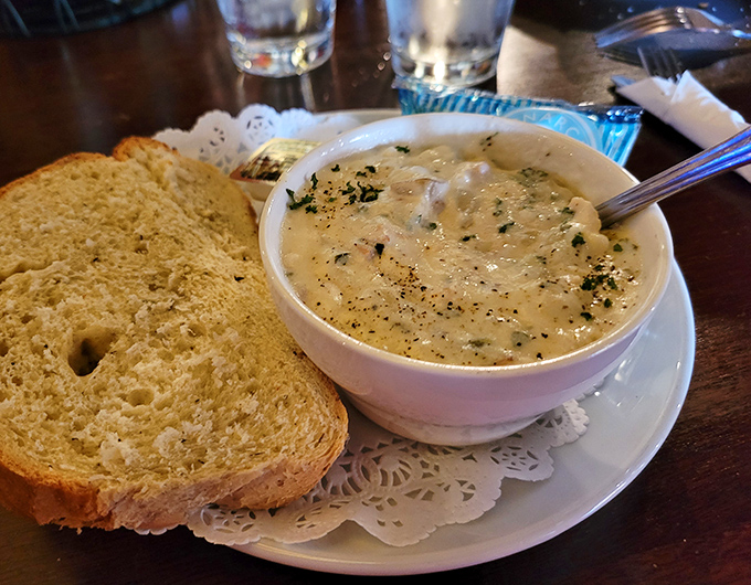 This isn't just clam chowder; it's a creamy revelation that makes you question every other bowl you've ever called "good." The bread's just a bonus.