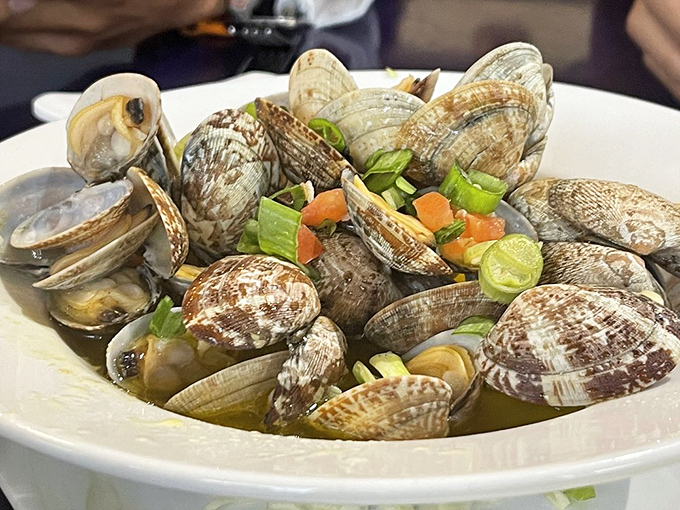 These clams aren't just steamed, they're having a little vegetable party in broth that tastes like the ocean bottled its best secrets.