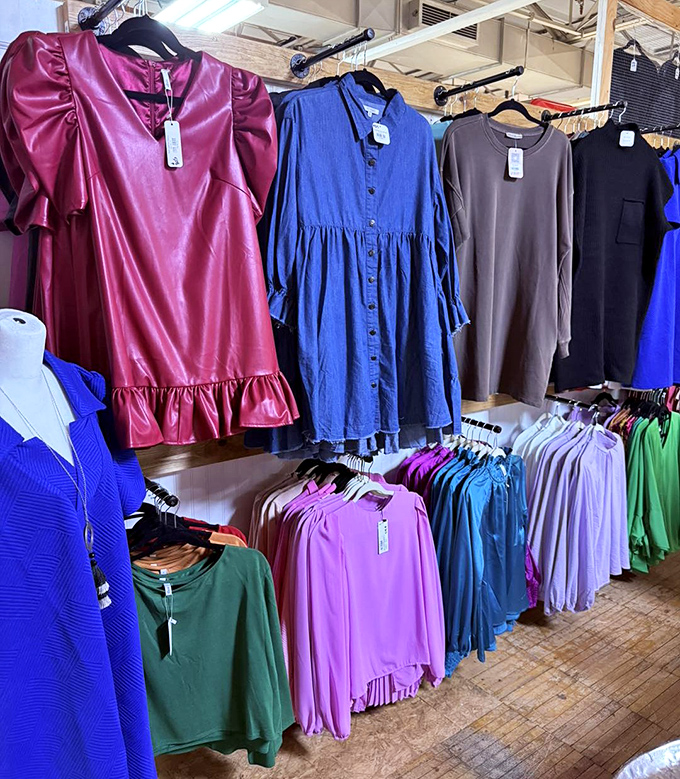 Fashion time capsules line these racks, from vibrant modern pieces to vintage gems. That blue dress is practically begging for a second life!