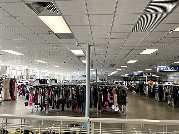 The clothing section: where vintage treasures hide between everyday basics, waiting for someone with a good eye to discover them.