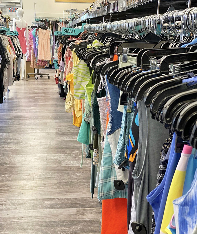 Rack after colorful rack creates a fashion labyrinth where getting lost means finding exactly what your wardrobe's been missing.