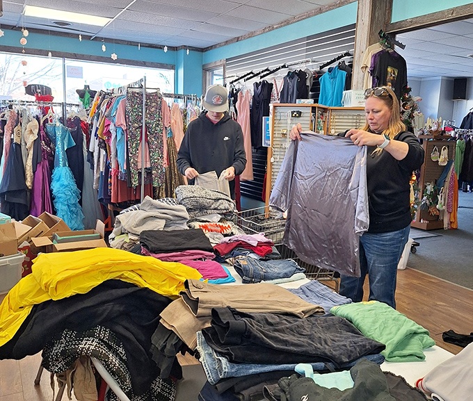 The clothing section transforms shopping into an archaeological expedition where patient explorers unearth fashion gems among neatly organized racks.