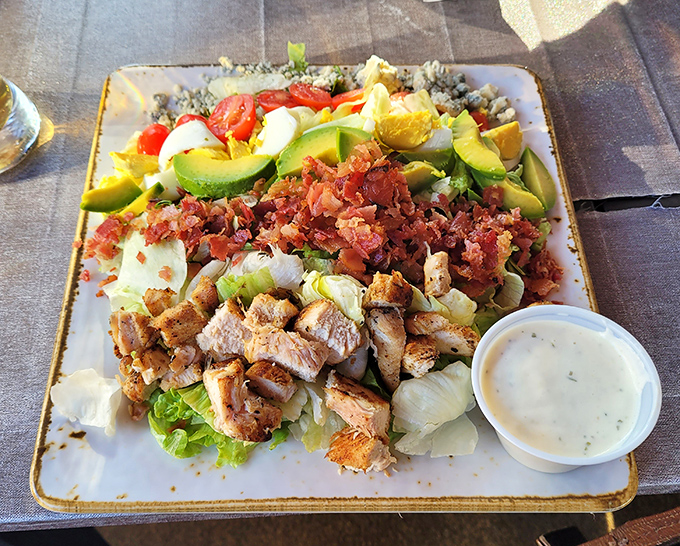 Behold the Cobb salad that launched a thousand return visits! Perfectly arranged protein paradise with avocado slices standing at attention like delicious green soldiers.