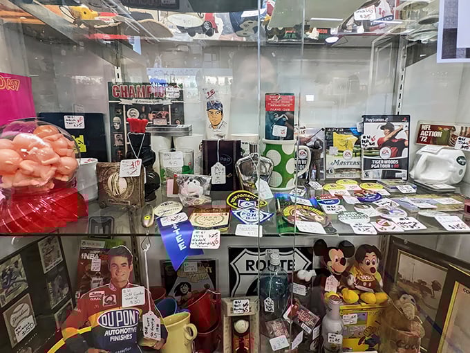 Nostalgia under glass: Mickey Mouse meets sports memorabilia in a display case that's basically your childhood secured behind plexiglass.