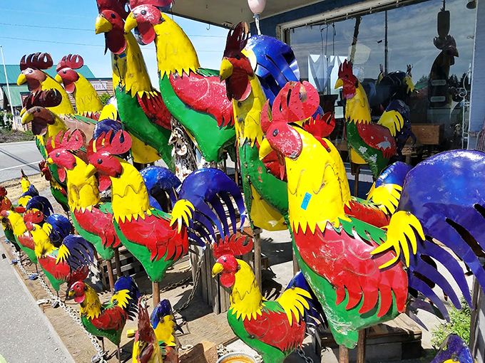 A rainbow regiment of metal roosters stands at attention, ready to add farmhouse whimsy to any garden. Morning alarm clock not included!