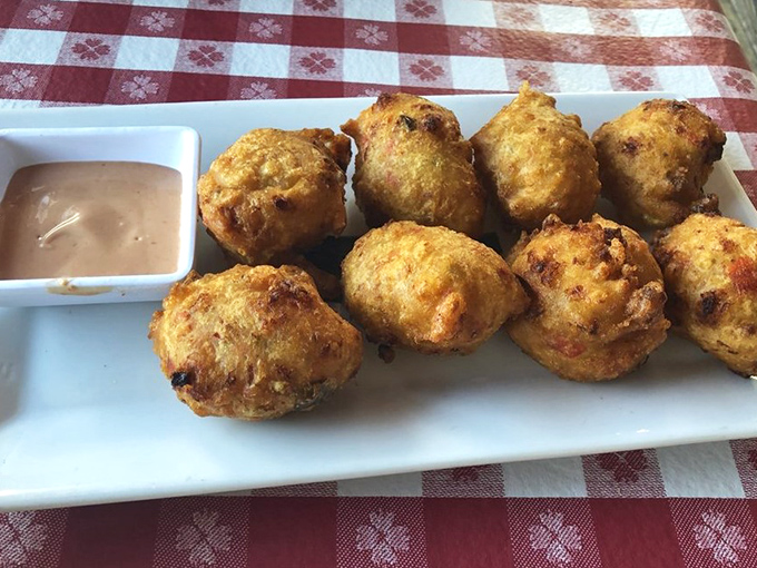 Golden-brown spheres of joy! These conch fritters are what food dreams are made of &ndash; crispy outside, tender inside, with that perfect ocean-kissed flavor.