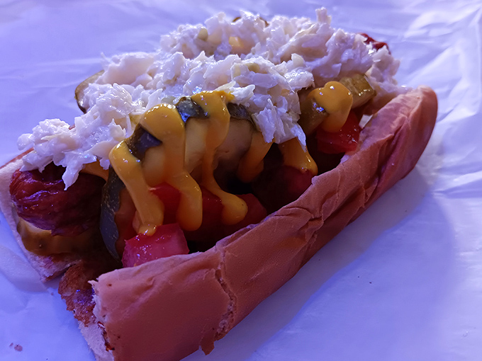 The star of the show: a footlong masterpiece topped with sauerkraut, mustard, and that legendary meatless coney sauce that defies explanation but demands devotion.