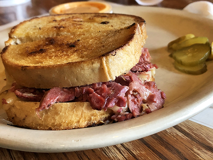 The Reuben sandwich here isn't just lunch—it's architecture, engineering, and art all stacked between perfectly grilled bread with a pickle sentinel.