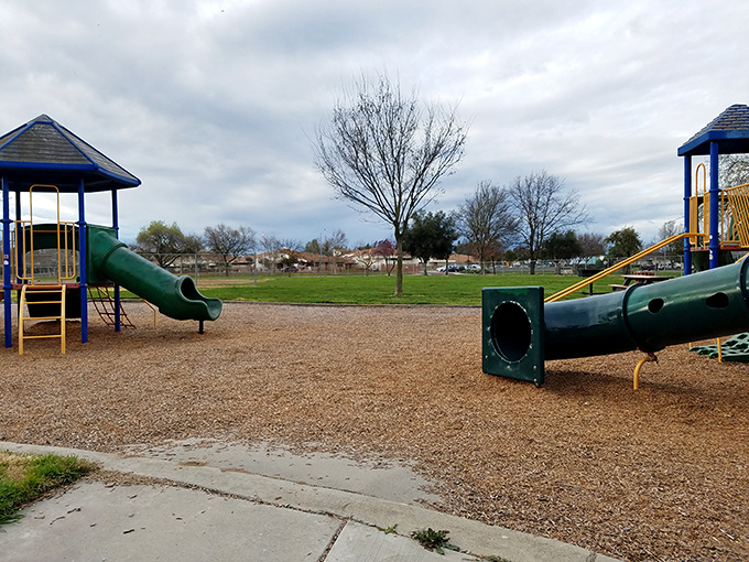 At Cottles Wood Park, the slides and climbing structures stand ready for adventure, like fitness equipment for the imagination.