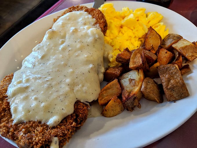 Behold the legendary Country Fried Steak &ndash; a golden-crusted masterpiece swimming in peppery gravy with eggs and potatoes standing by as worthy sidekicks.