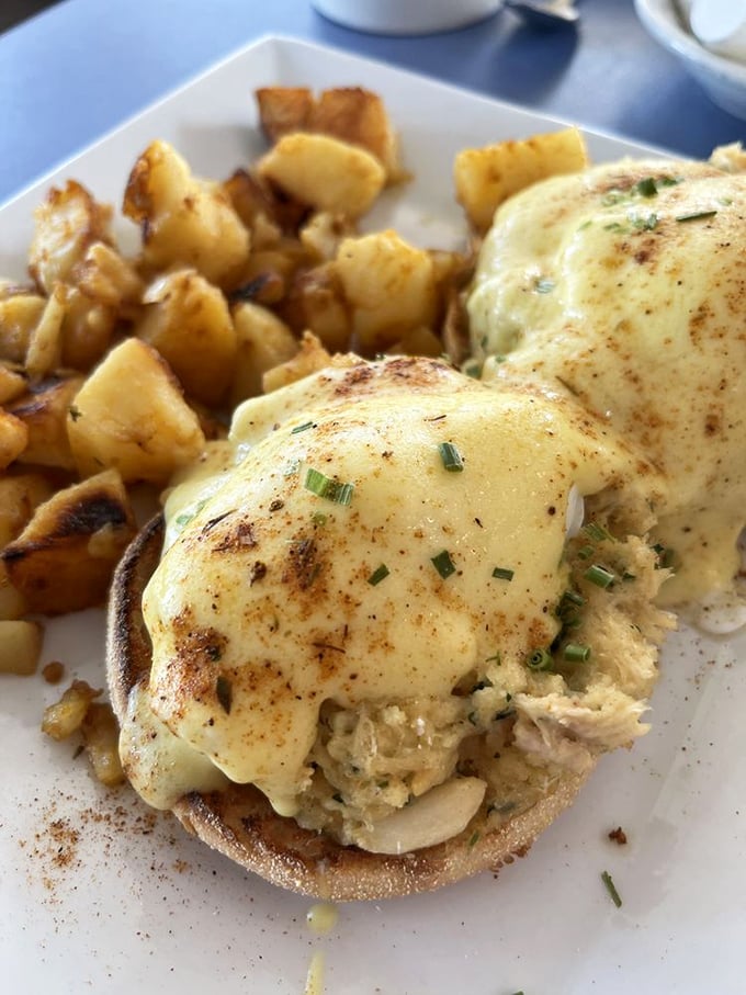 Behold the Crab Cake Benedict – where Maryland meets New England in a breakfast romance that would make Shakespeare weep with joy.