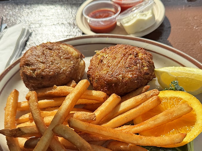 Golden-brown perfection on a plate. These crab cakes are what Maryland dreams are made of&mdash;mostly crab, minimal filler, maximum flavor.