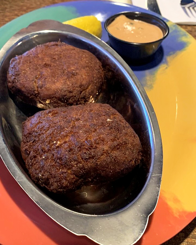 These crab cakes arrive looking like golden treasures, crispy outside and ready to reveal their sweet secrets.
