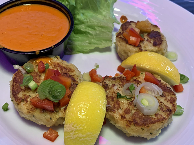 These aren't just crab cakes; they're golden discs of oceanic perfection. More crab than cake, served with a sauce that deserves its own fan club.