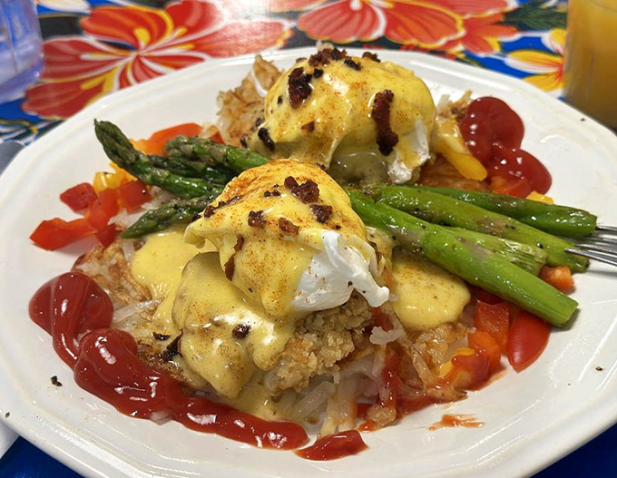 This isn't your sad hotel buffet crab cake &ndash; it's golden-crusted perfection topped with hollandaise like edible sunshine.