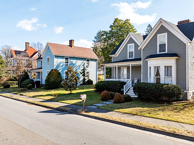 Colorful historic homes line quiet streets, each one telling a different architectural story while sharing the same small-town soundtrack.