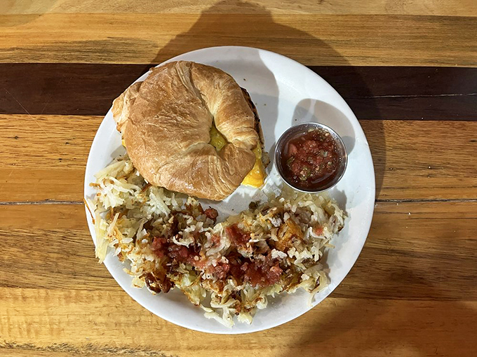 That croissant sandwich with perfectly seasoned hash browns proves carbs are not the enemy, they're old friends.