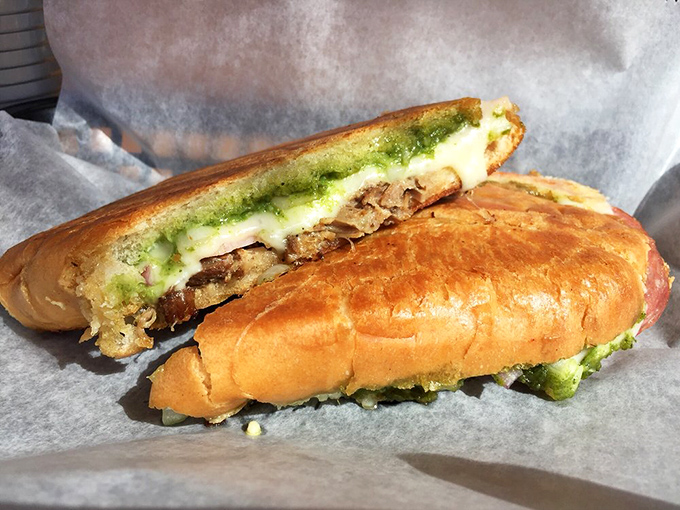 Behold the pressed perfection! This Cuban sandwich's crispy exterior gives way to melty cheese and savory fillings&mdash;a handheld masterpiece of contrasting textures.