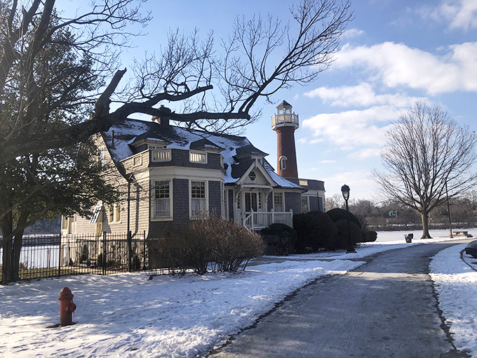 Winter transforms the lighthouse into a snow-dusted fairy tale. Even Jack Frost seems to appreciate this riverside anomaly.